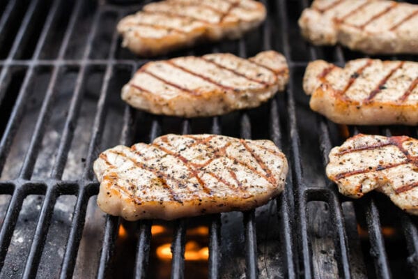 Grilled Pork Chops in Lemon Herb Marinade - Amanda's Cookin' - Pork