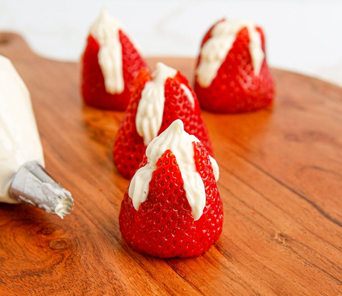 Cheesecake Stuffed Strawberries - Amanda's Cookin' - Cheesecakes