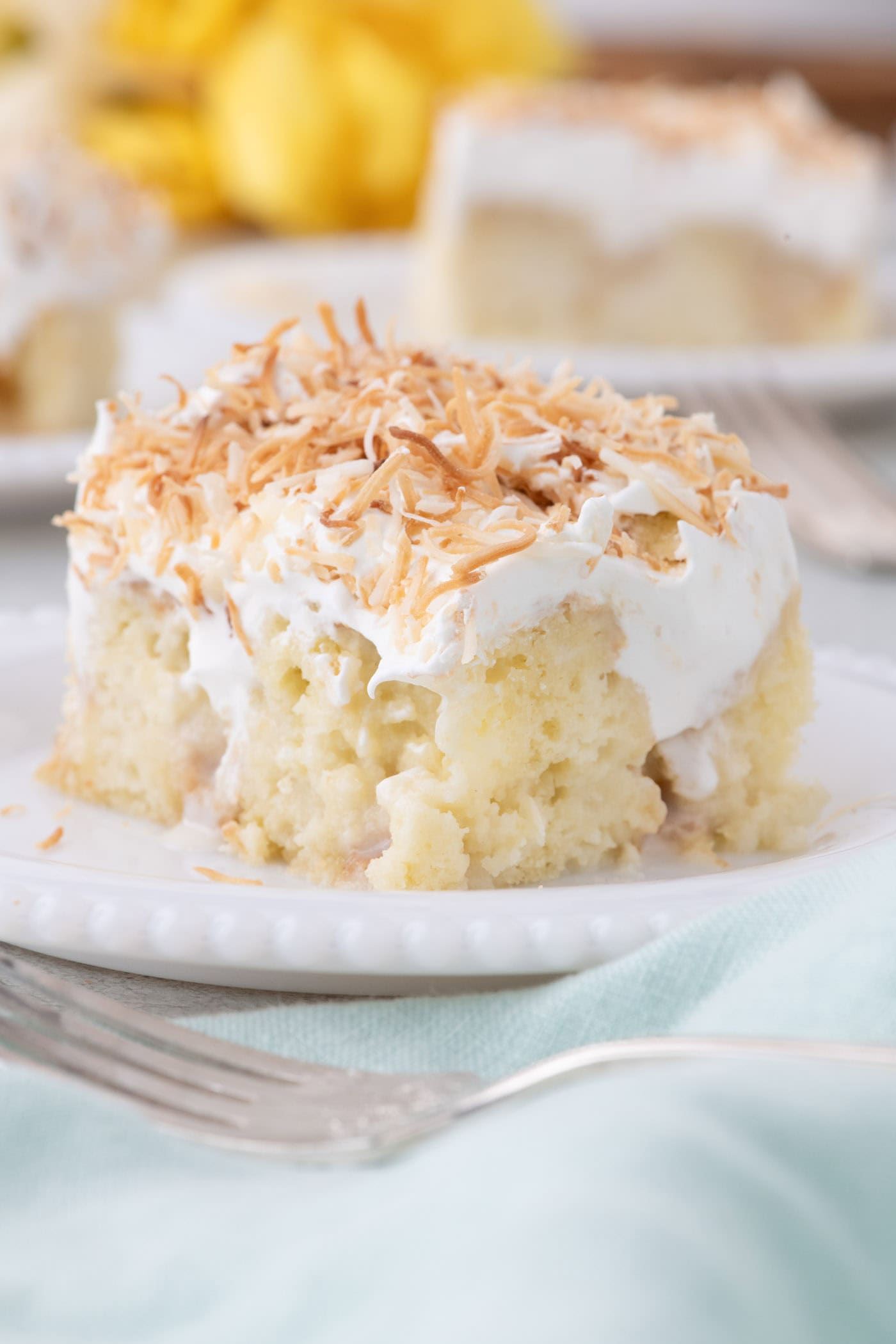 Coconut Poke Cake - Amanda's Cookin' - Cake & Cupcakes